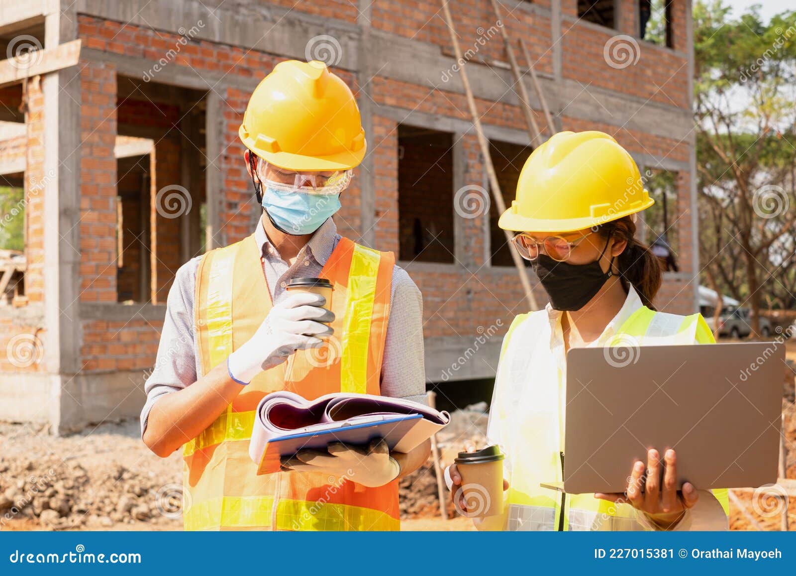 A Team of Man and Female Engineers or Architects is Exploring and ...