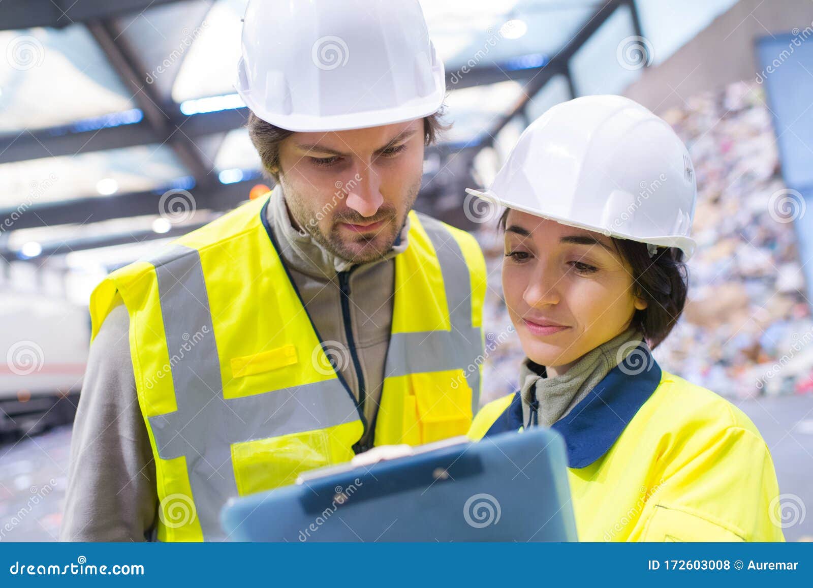 Team Manager and Technician Discussing Recycling Issues Stock Photo ...