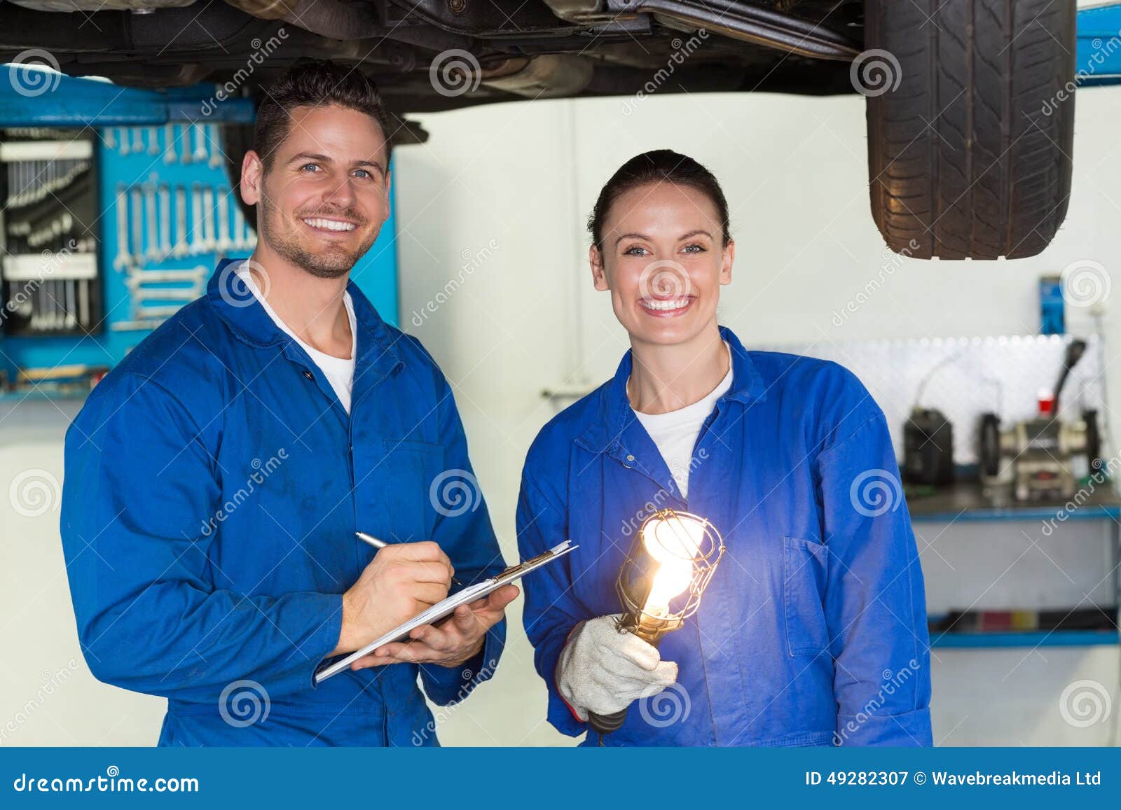 Team of Mechanics Smiling at Camera Stock Image - Image of cheerful ...