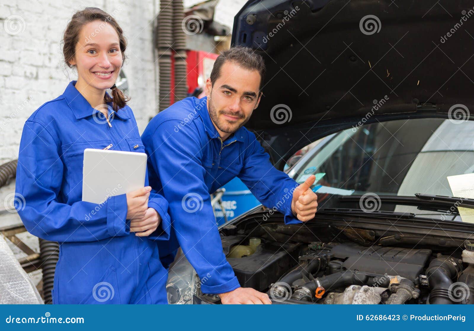 Team of Mechanics Working at the Garage Stock Image - Image of repair ...