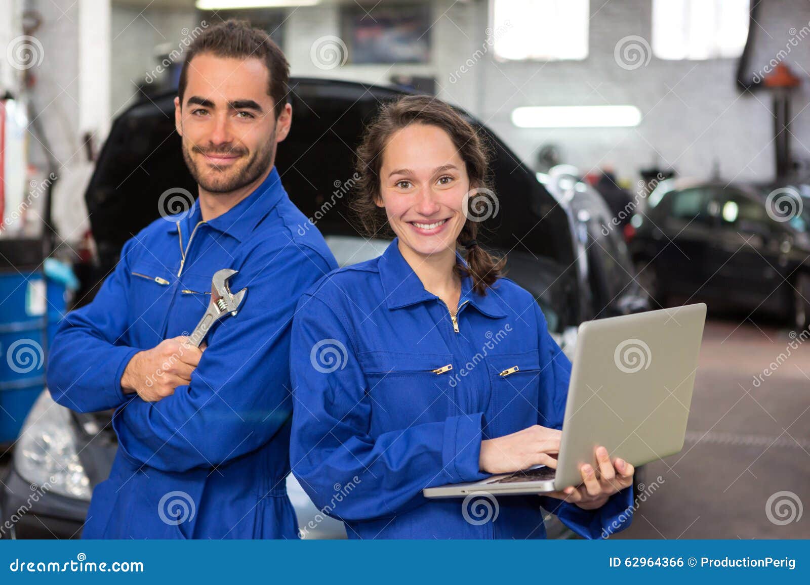 Team of Mechanics Working at the Garage Stock Photo - Image of garage ...