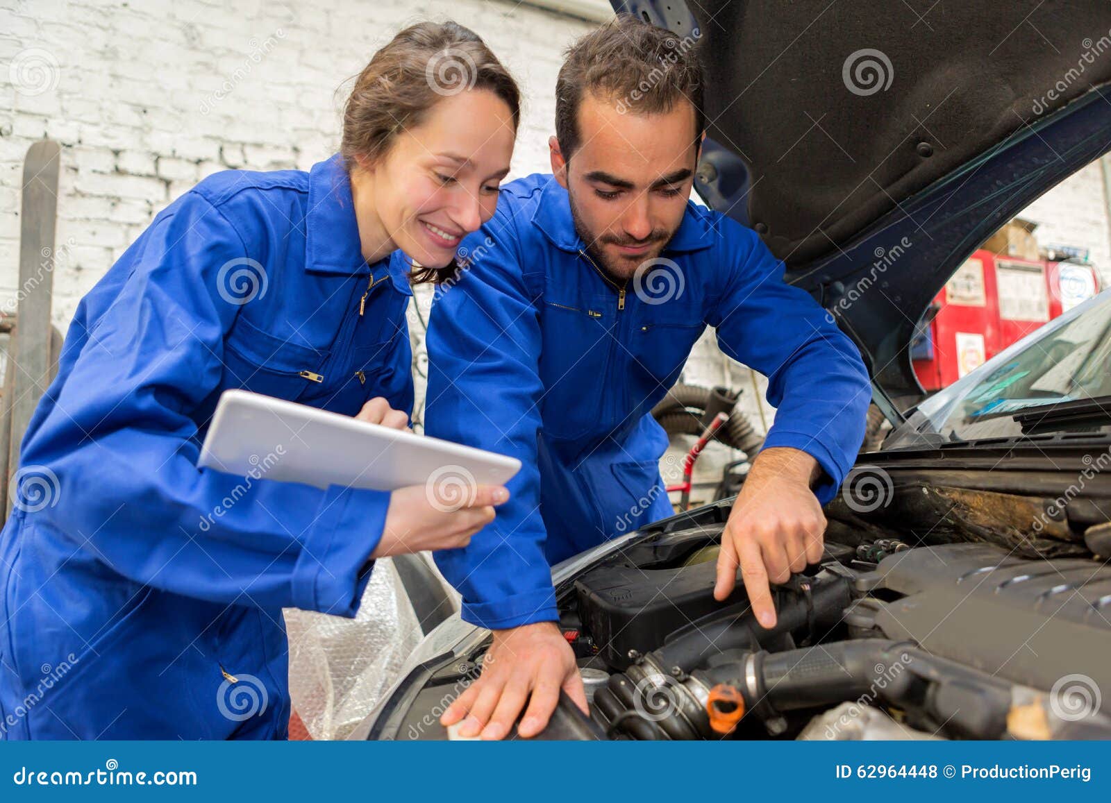 Team of Mechanics Working at the Garage Stock Photo - Image of garage ...