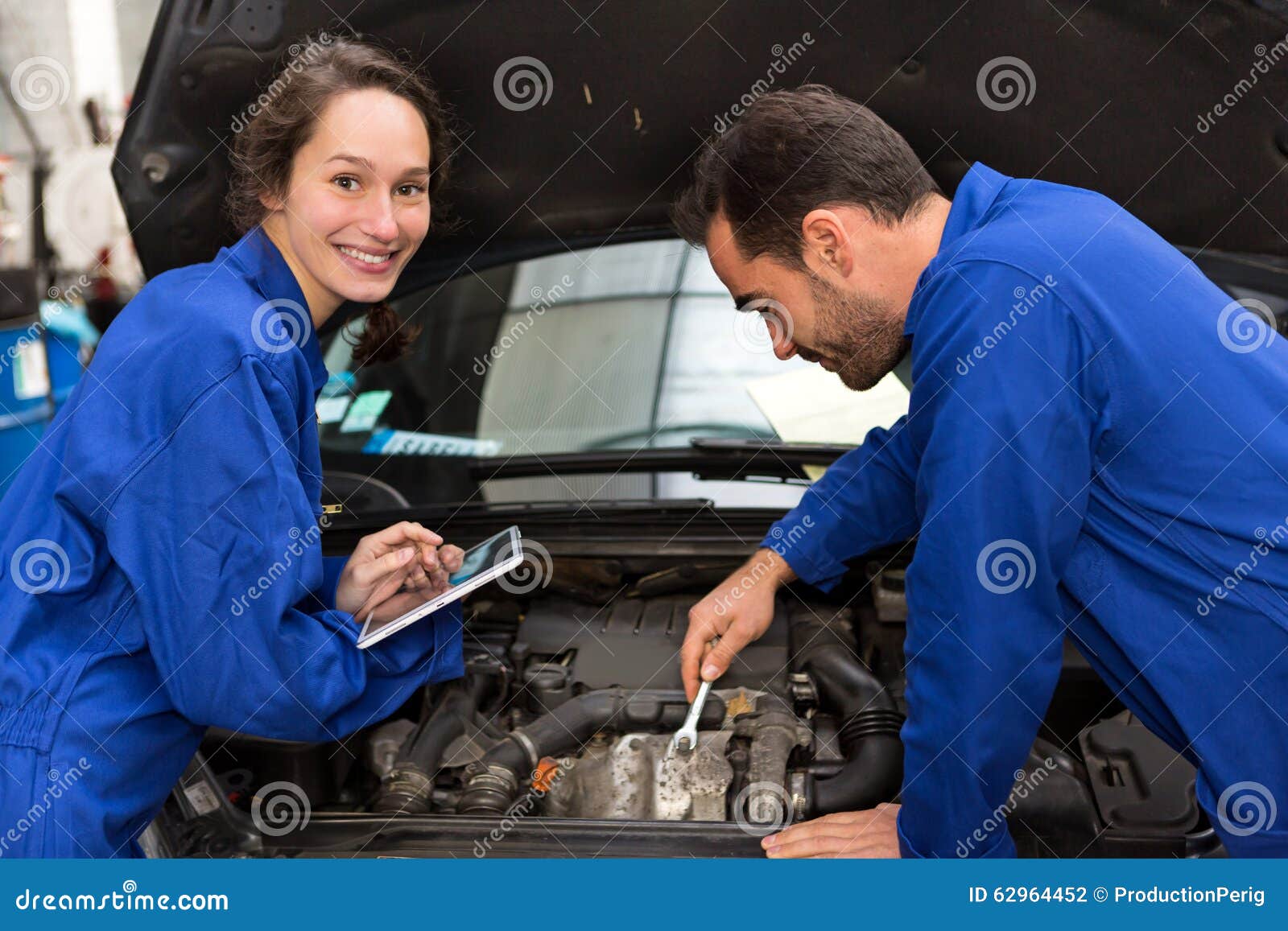 Team of Mechanics Working at the Garage Stock Photo - Image of industry ...