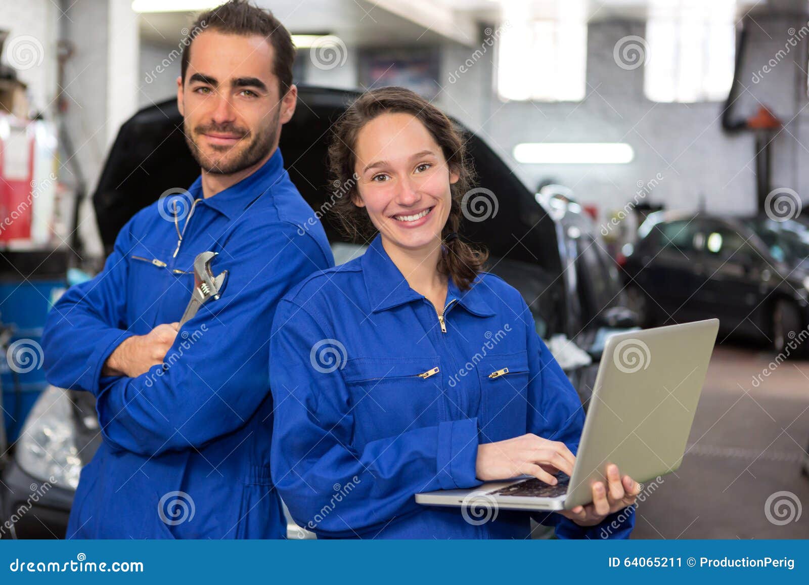Team of Mechanics Working at the Garage Stock Image - Image of happy ...