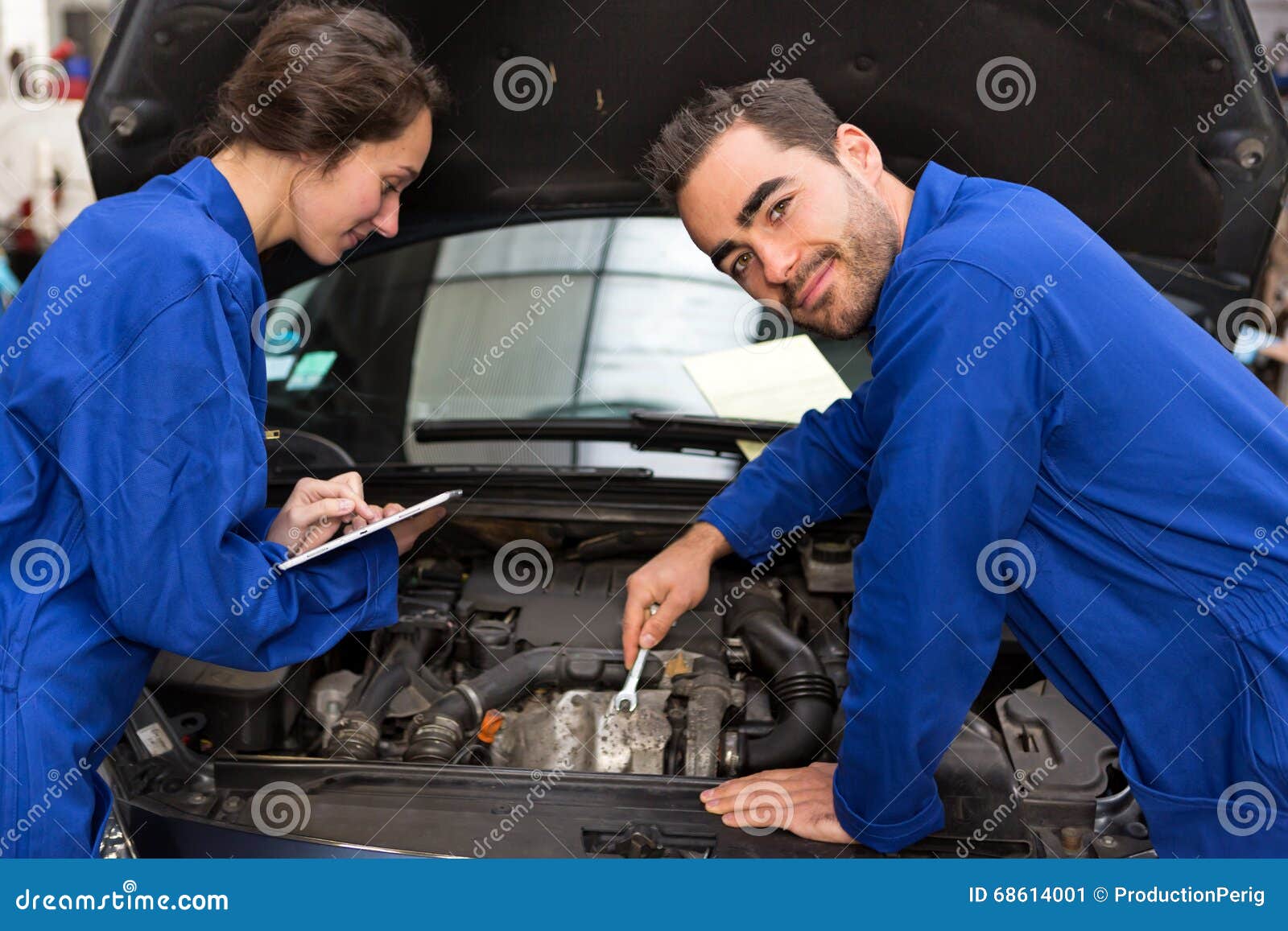 Team of Mechanics Working at the Garage Stock Image - Image of garage ...