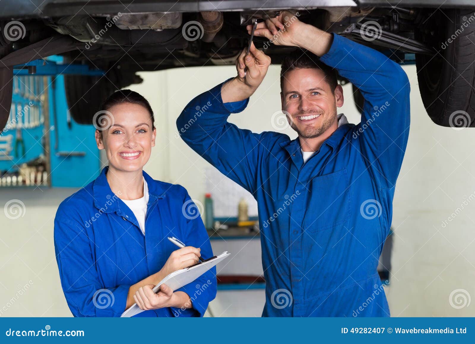 Team of Mechanics Working Together Stock Image - Image of occupation ...