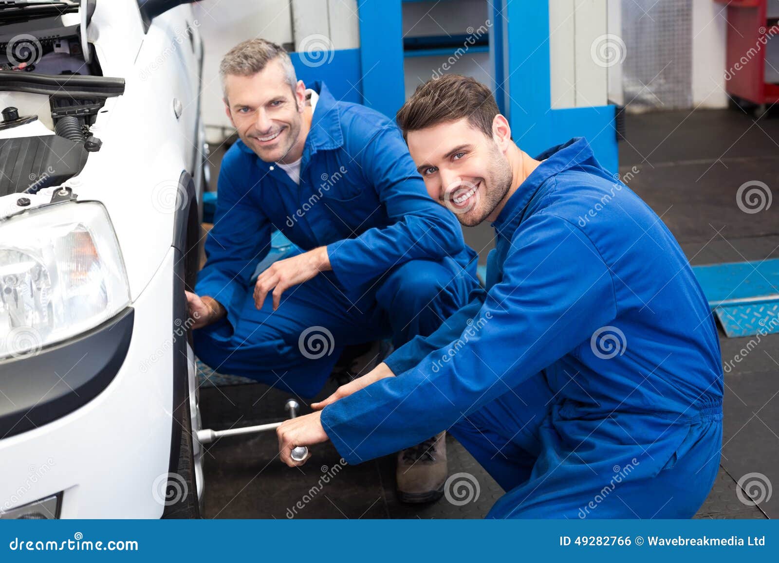 Team of Mechanics Working Together Stock Photo - Image of colleagues ...