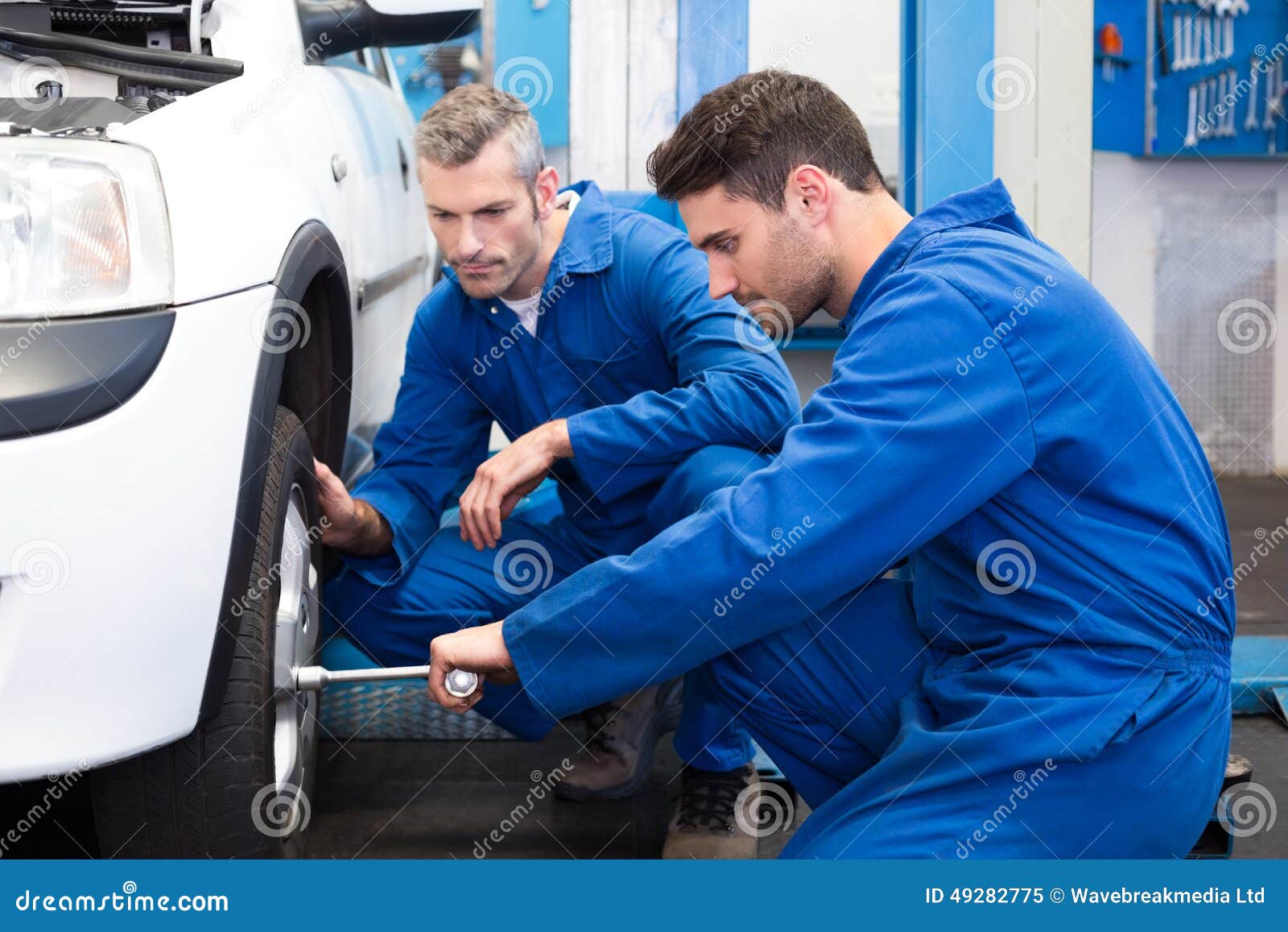 Team of Mechanics Working Together Stock Image - Image of repairing ...