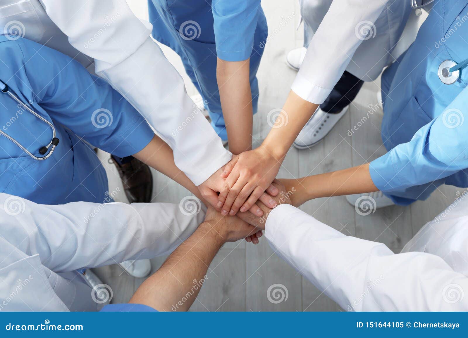 Team of Medical Workers Holding Hands Together Indoors, Top View Stock ... Team of Medical Workers Holding Hands Together Indoors, Top View Stock ...