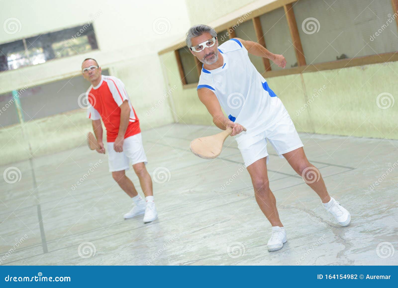 Team men playing pala stock photo. Image of energetic - 164154982