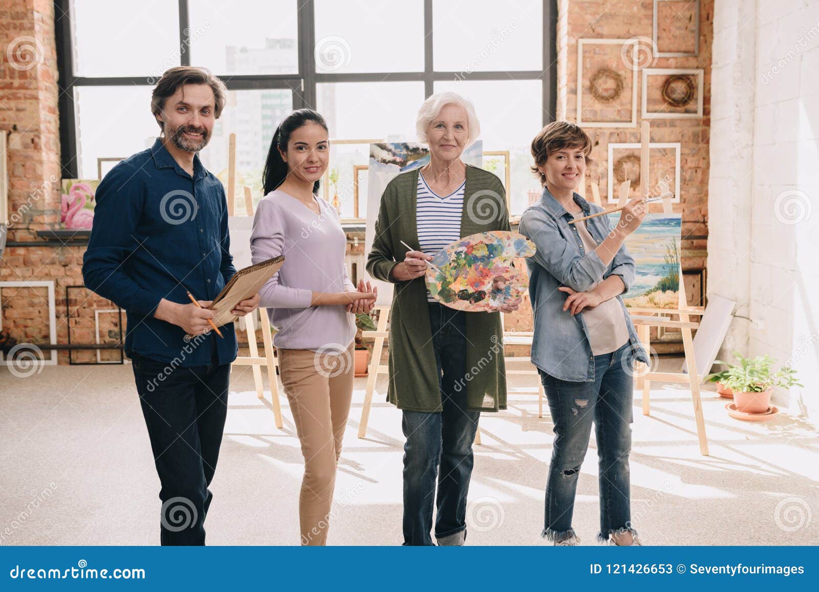 Team of Modern Artists Posing in Studio Stock Image - Image of people ...
