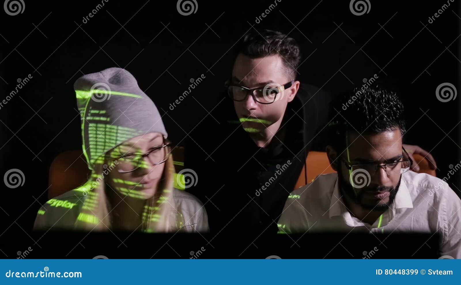 Team of Multiethnic it Professionals Working with Computers in Dark ...