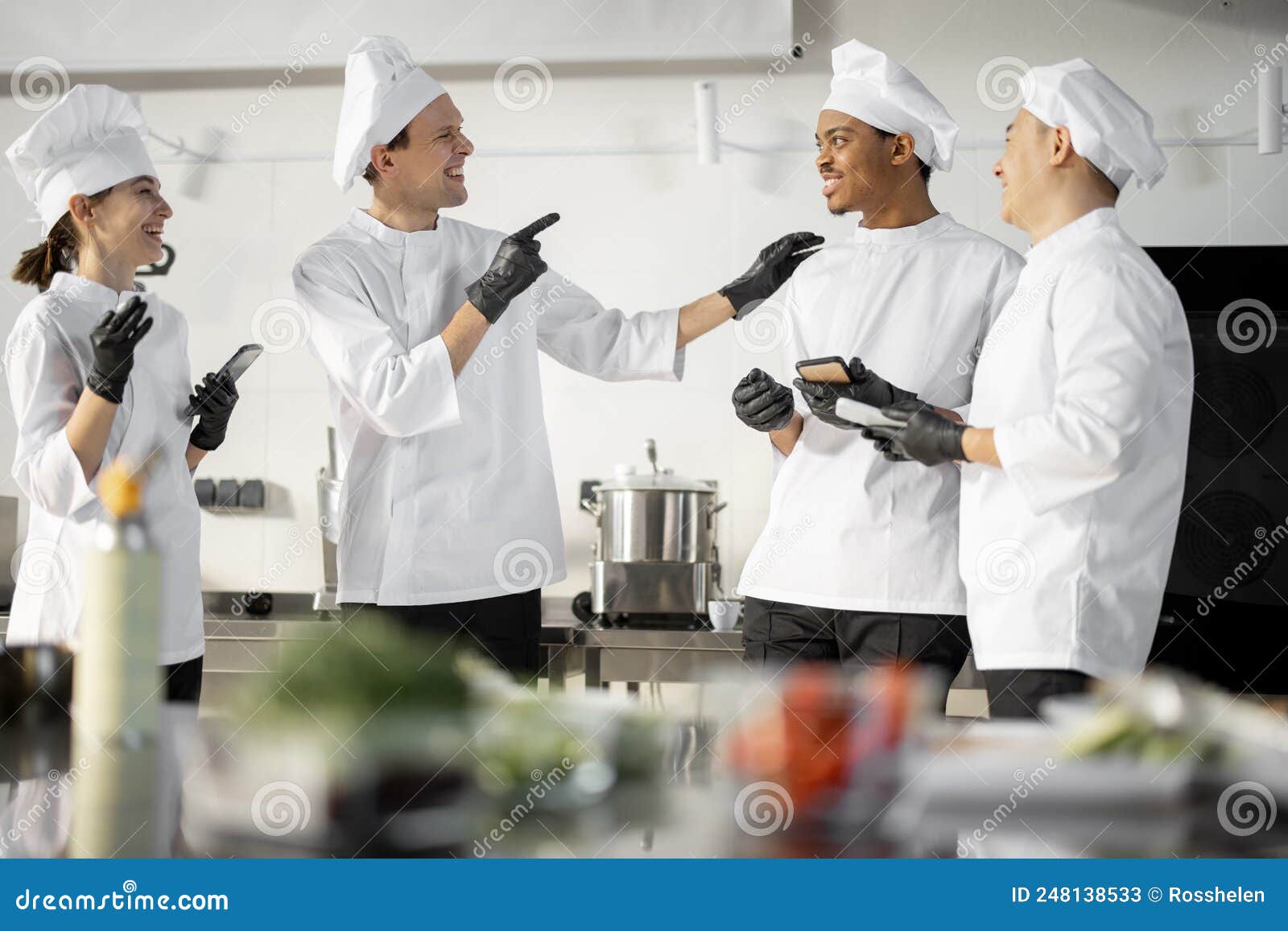 Team of Multiracial Cooks Having Conversation during a Coffee Break in ...