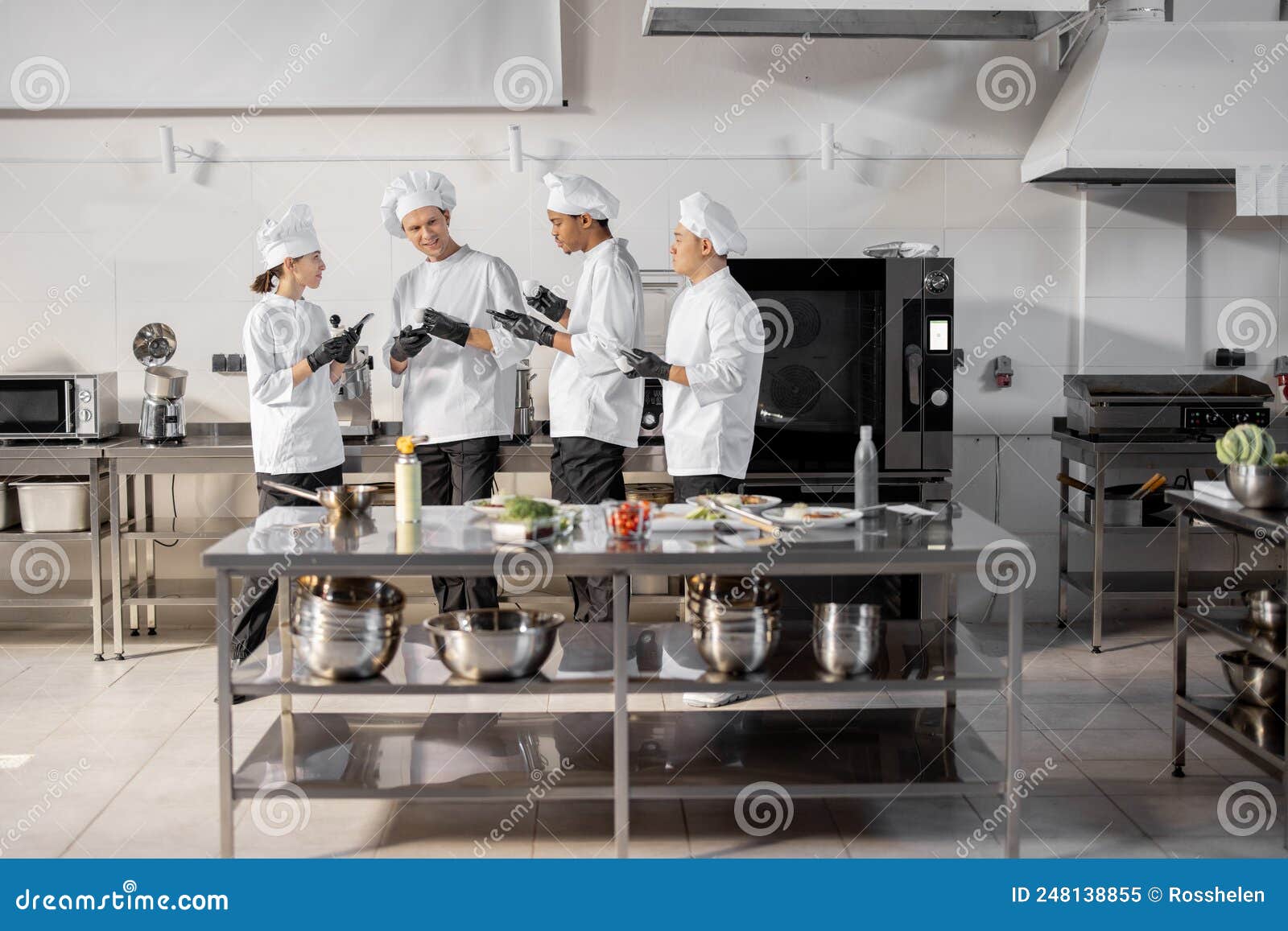 Team of Multiracial Cooks Having Conversation during a Coffee Break in ...