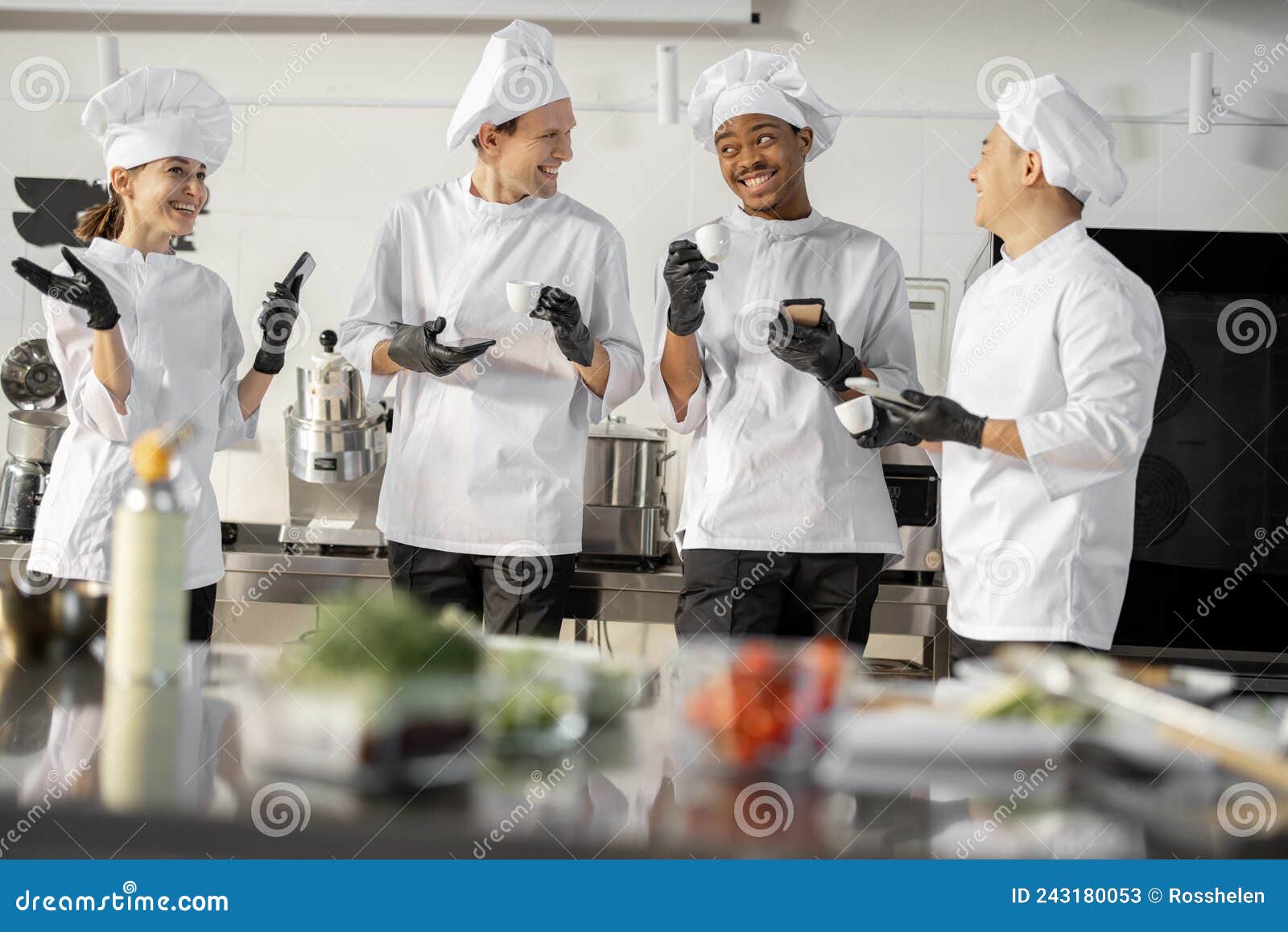 Team of Multiracial Cooks Having Conversation during a Coffee Break in ...