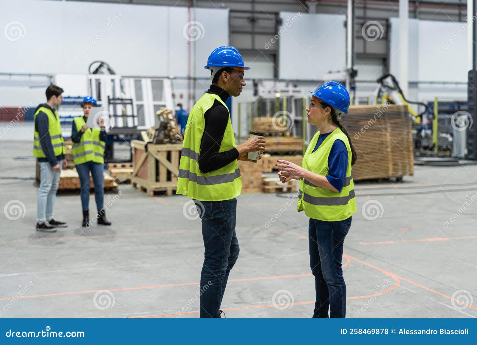 Team of Multiracial Engineers Working in Robotic Factory Stock Photo ...