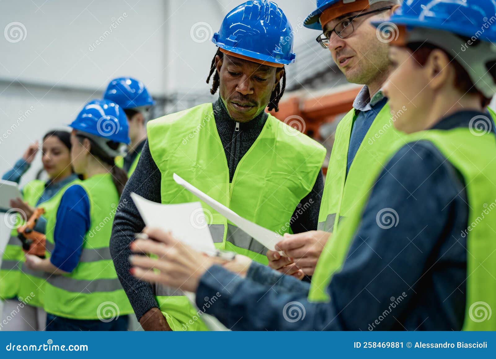 Team of Multiracial Engineers Working in Robotic Factory Stock Image ...