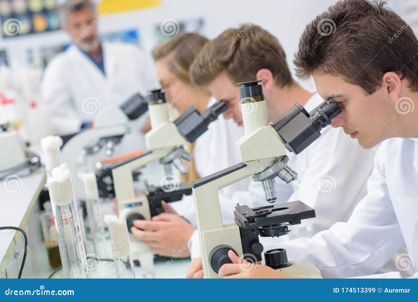 Team during Observation Under Microscope Stock Image - Image of science ...