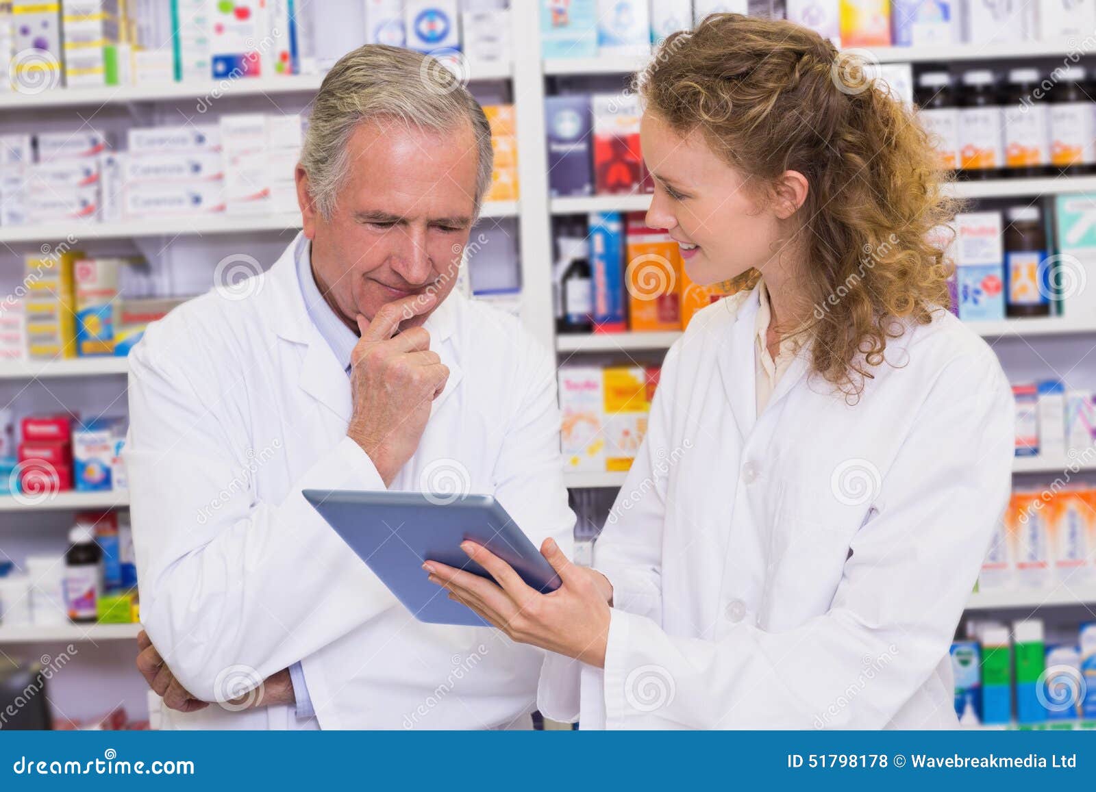 Team of Pharmacist Looking at Tablet Pc Stock Photo - Image of pharmacy ...