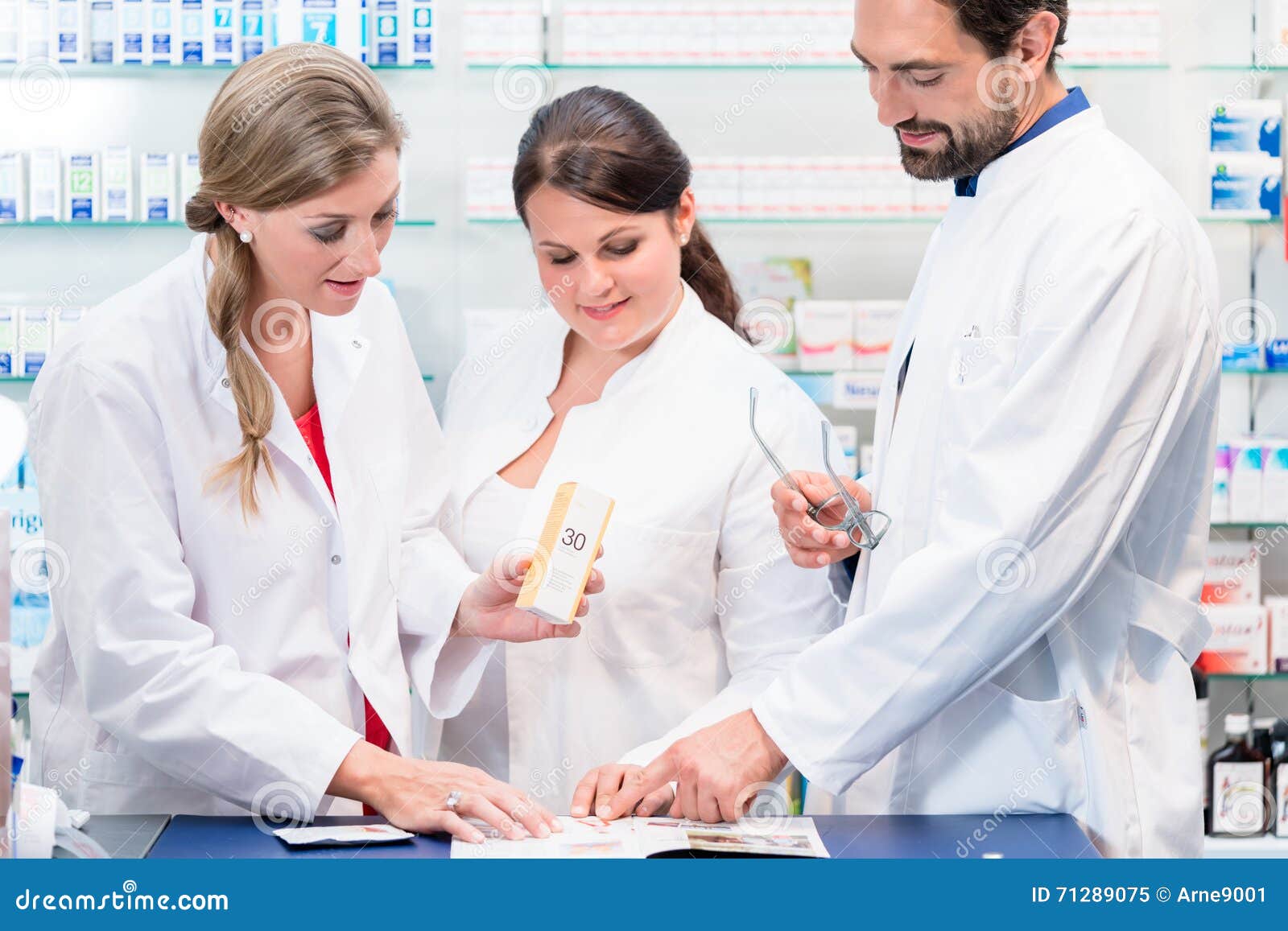 Team of Pharmacists in Drug Store Checking Pharmaceuticals Stock Image ...