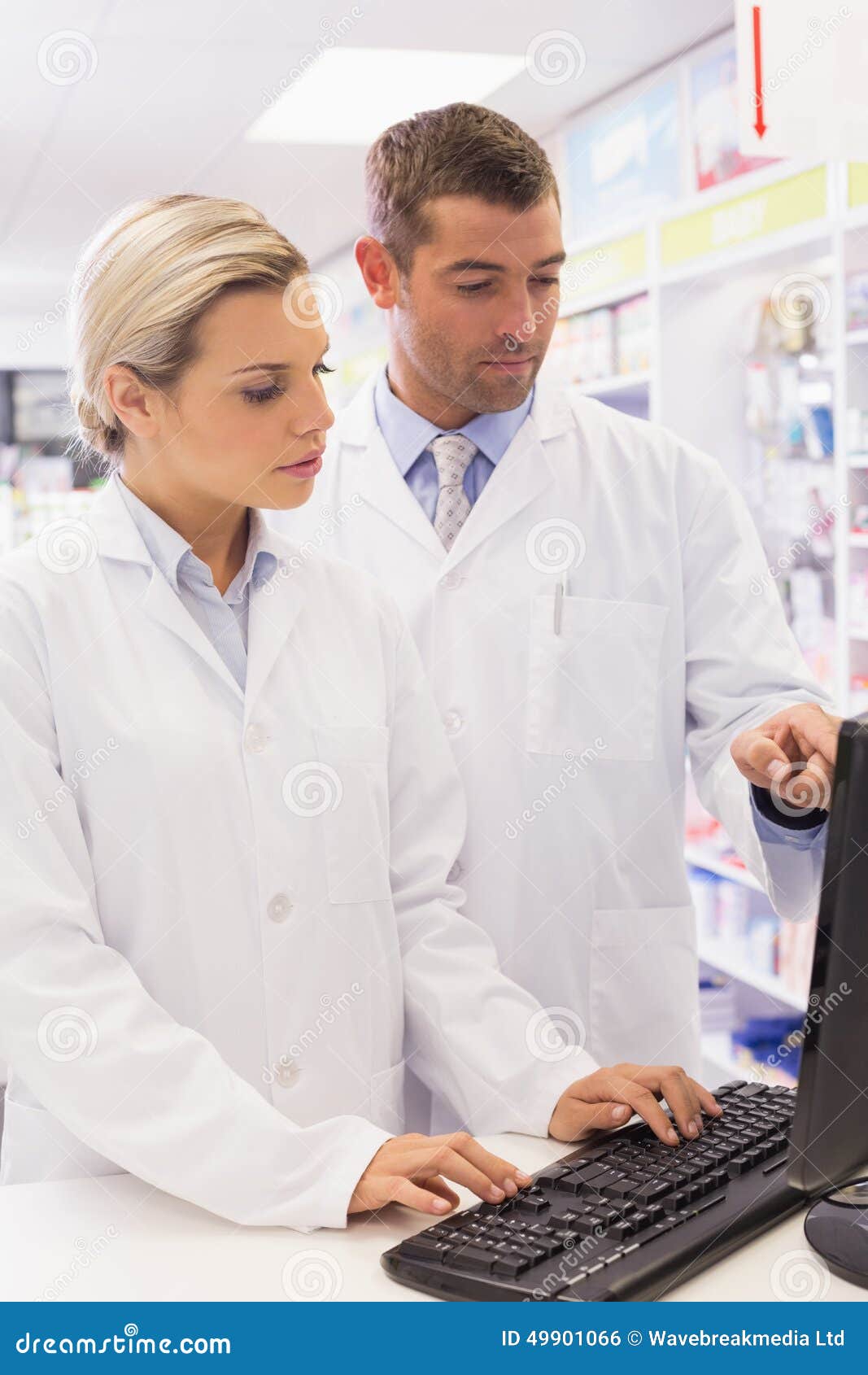 Team of Pharmacists Looking at Computer Stock Photo - Image of illness ...