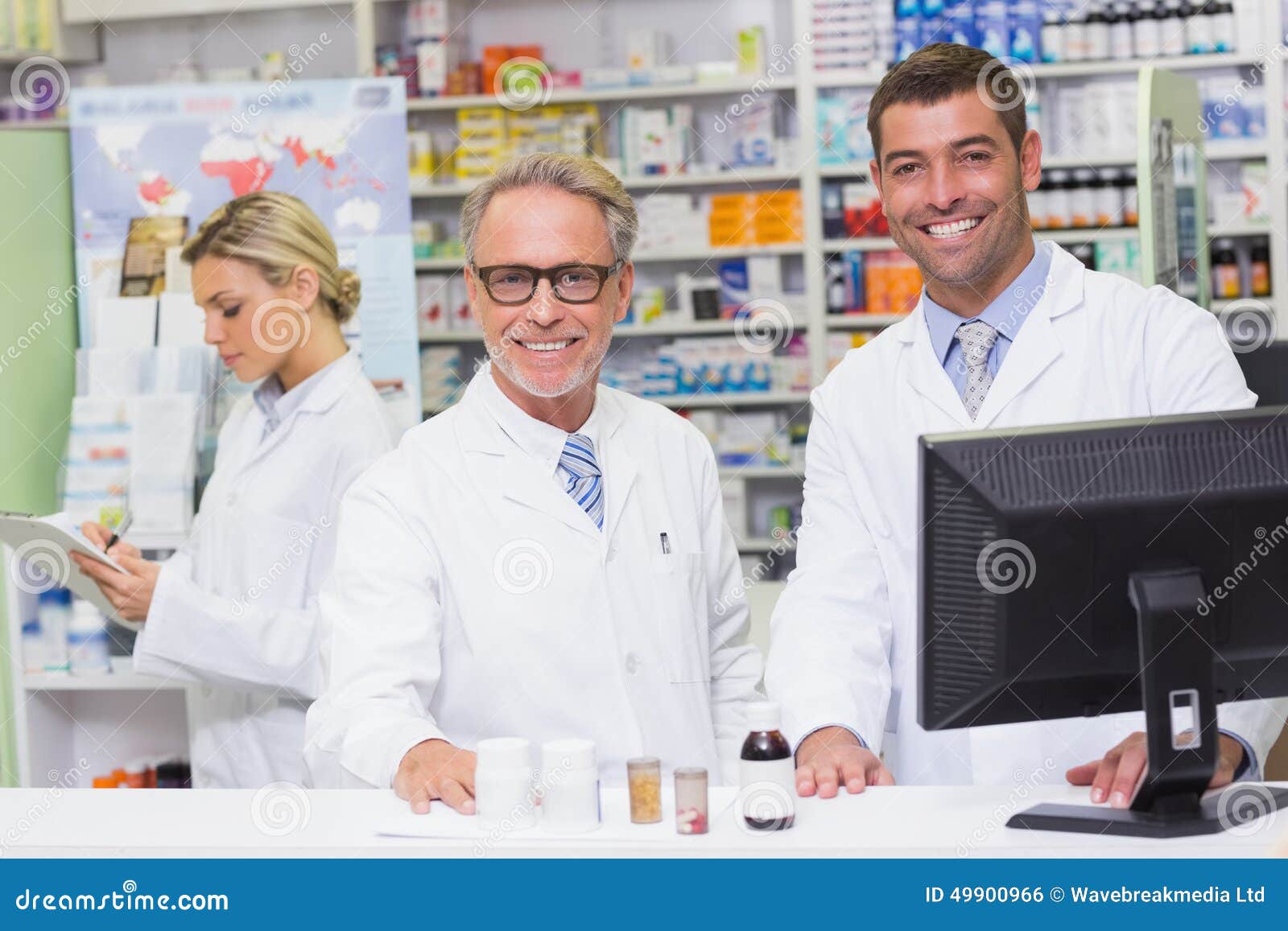 Team of Pharmacists Smiling at Camera Stock Photo - Image of indoors ...