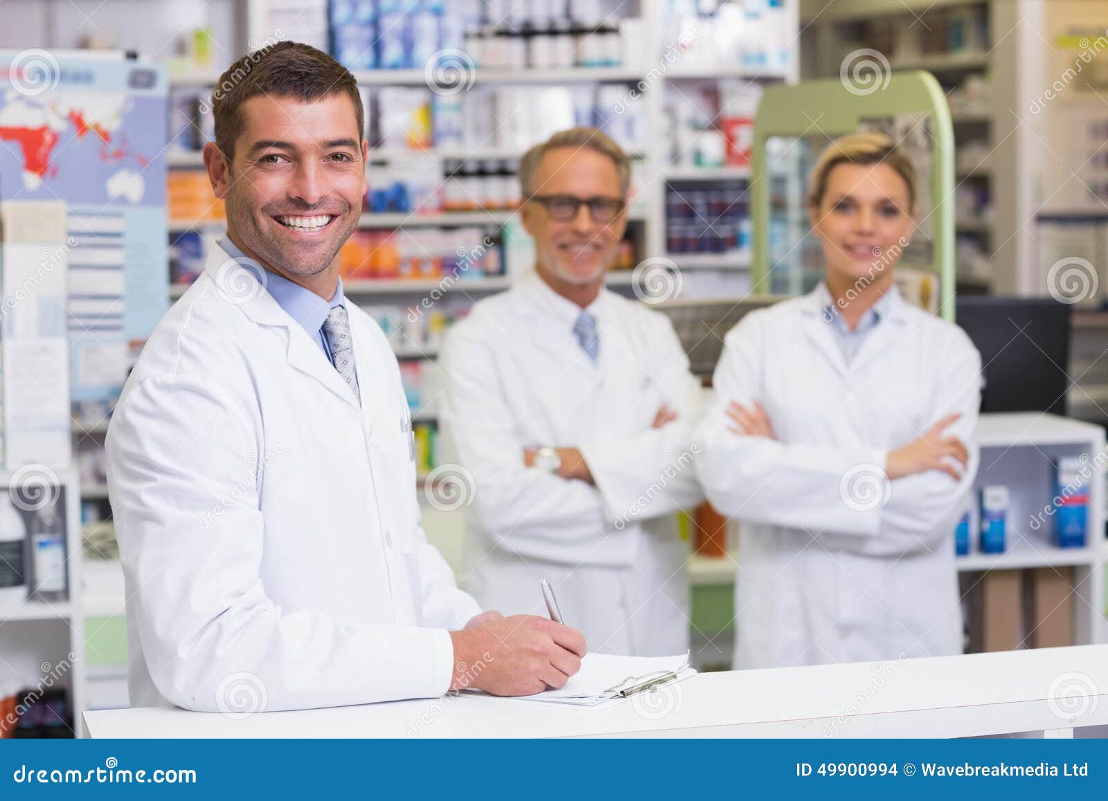Team of Pharmacists Smiling at Camera Stock Photo - Image of holding ...