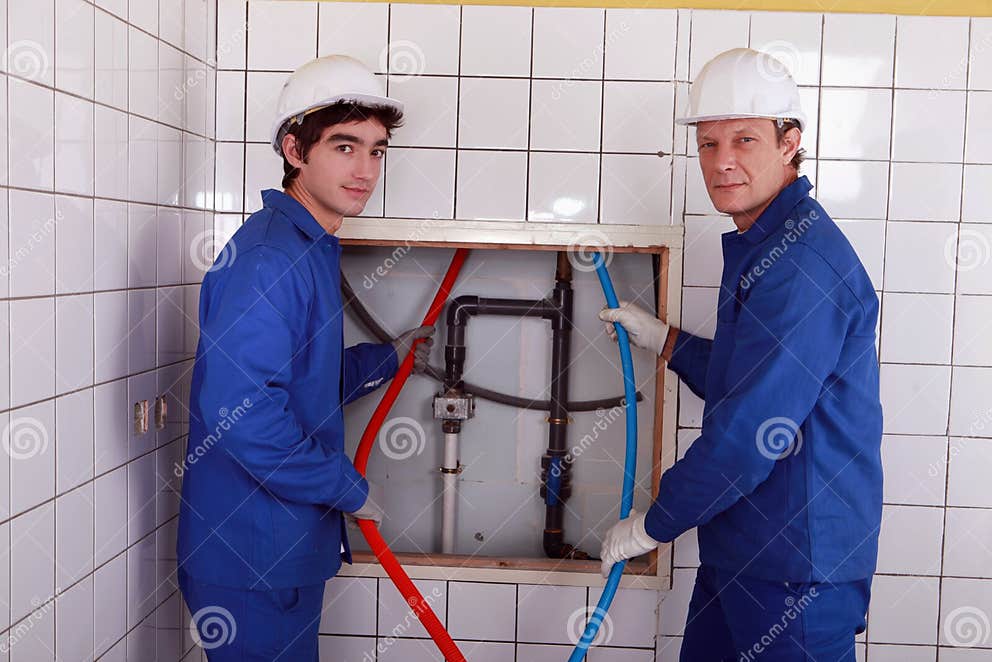 Team of plumbers stock image. Image of labor, occupation - 36896615