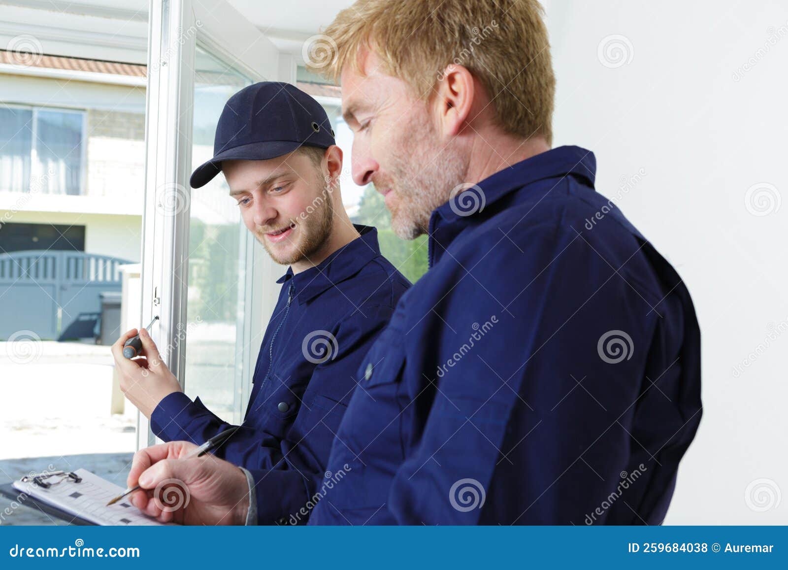 Team plumbers at work stock photo. Image of young, interior - 259684038