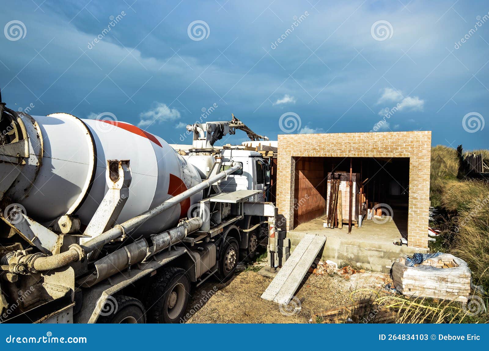 Team Pouring a Concrete Screed on a Construction Site of a Detached ...