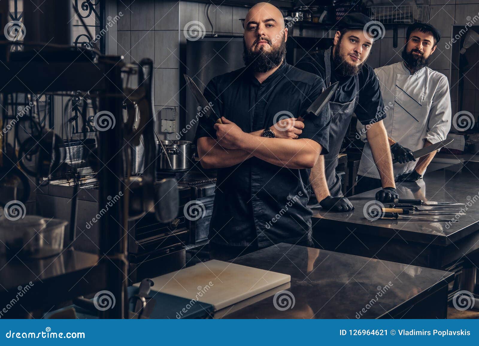 Team of Professional Bearded Cooks Dressed in Uniforms Posing with ...
