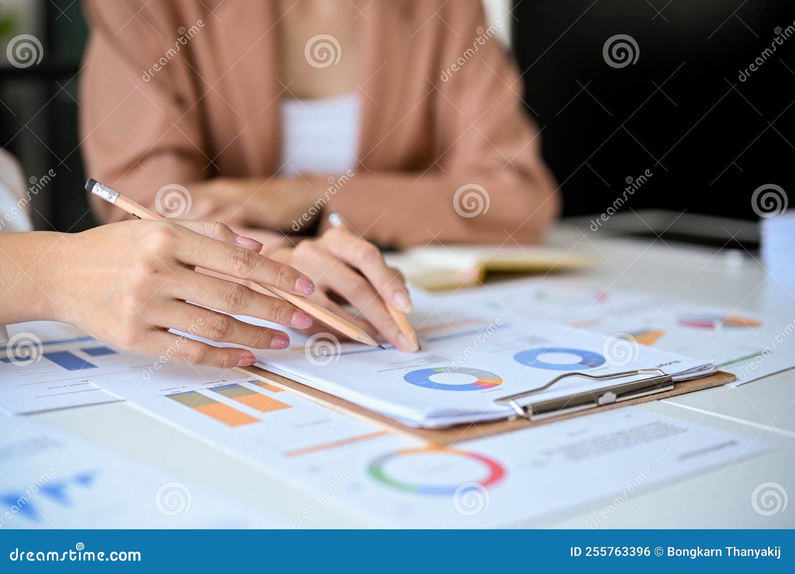 A Team of Professional Business and Financial Analysts Analyzing a ...