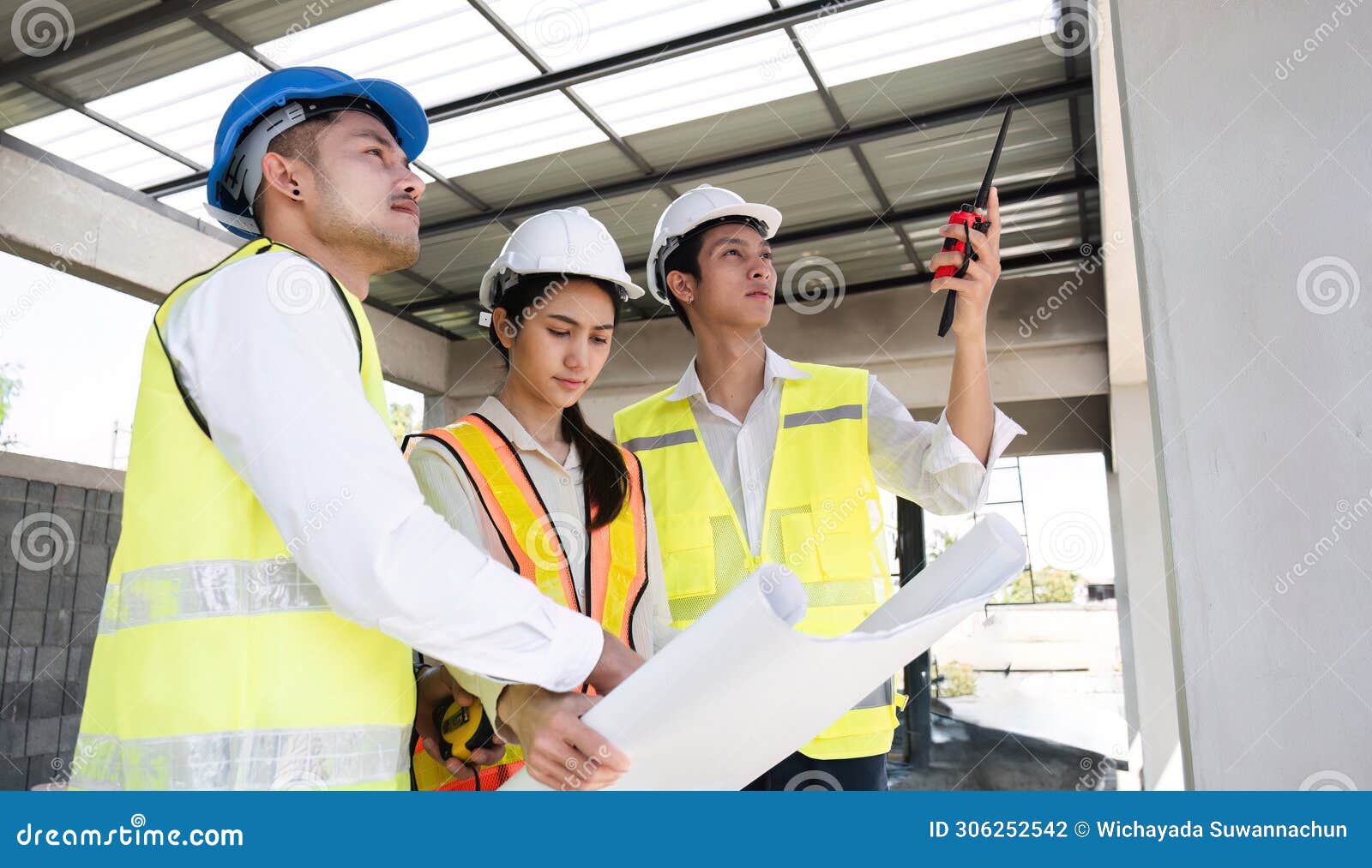 Team of Professional Civil Engineers and Architects Holding Project ...