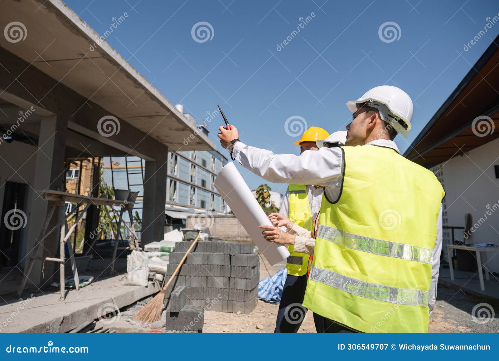 Team of Professional Civil Engineers and Architects Holding Project ...