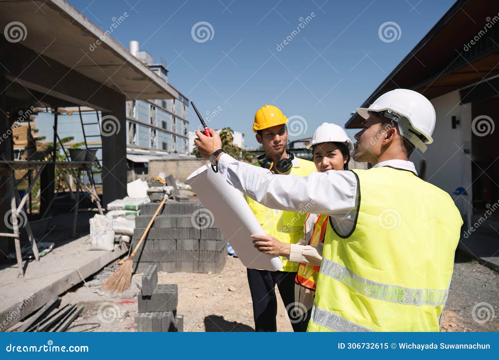 Team of Professional Civil Engineers and Architects Holding Project ...