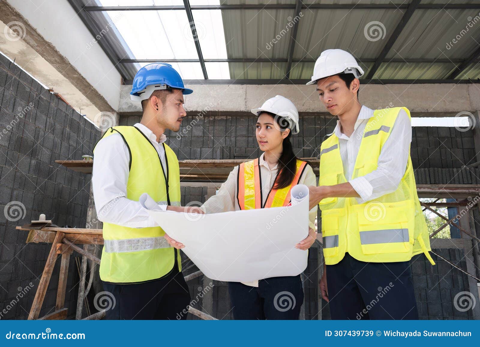 Team of Professional Civil Engineers and Architects Holding Project ...