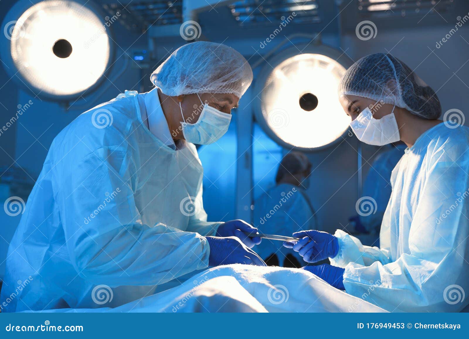 Team of Doctors Performing Operation in Surgery Room Stock Image ...