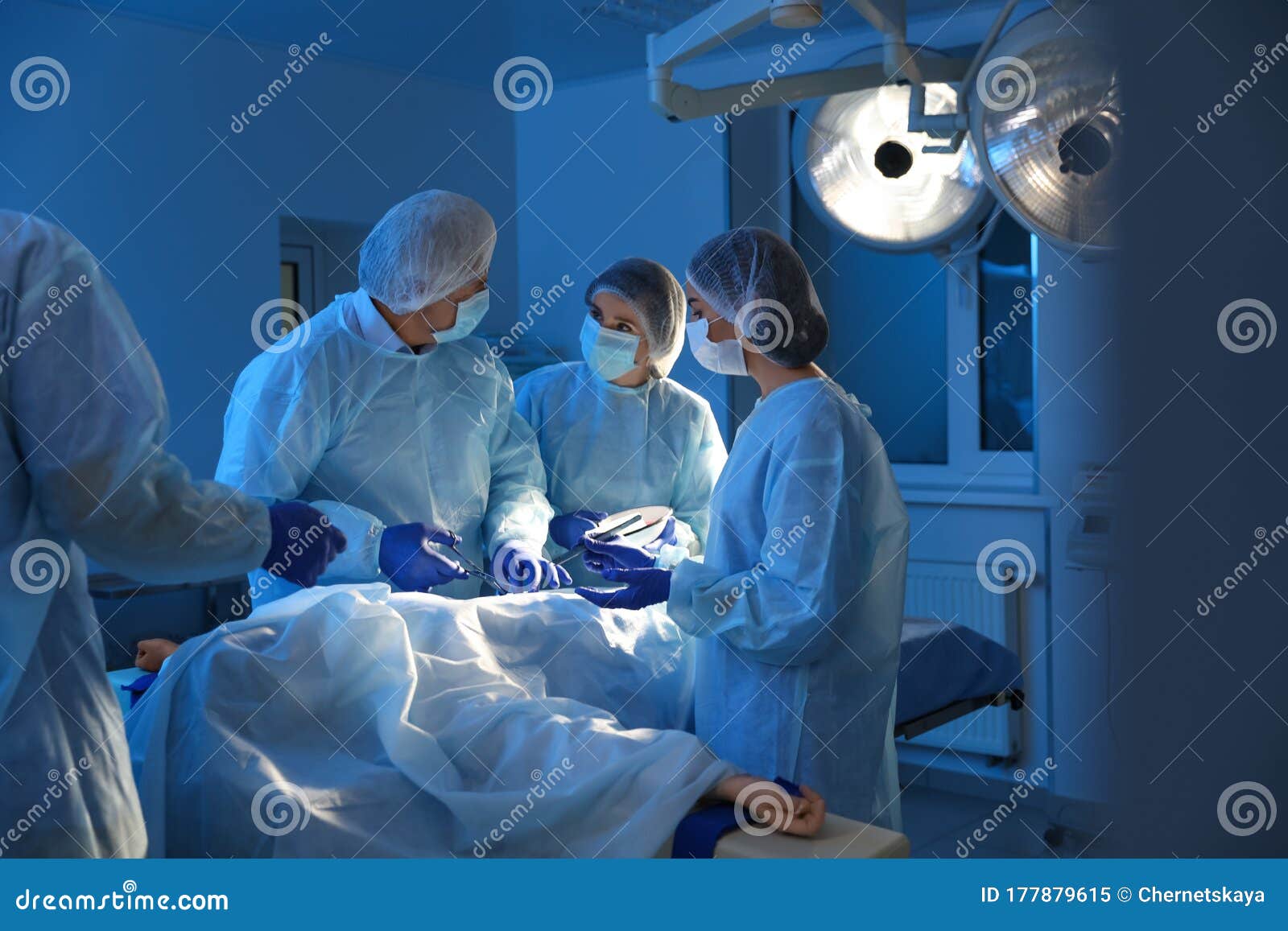 Team of Doctors Performing Operation in Surgery Room Stock Image ...