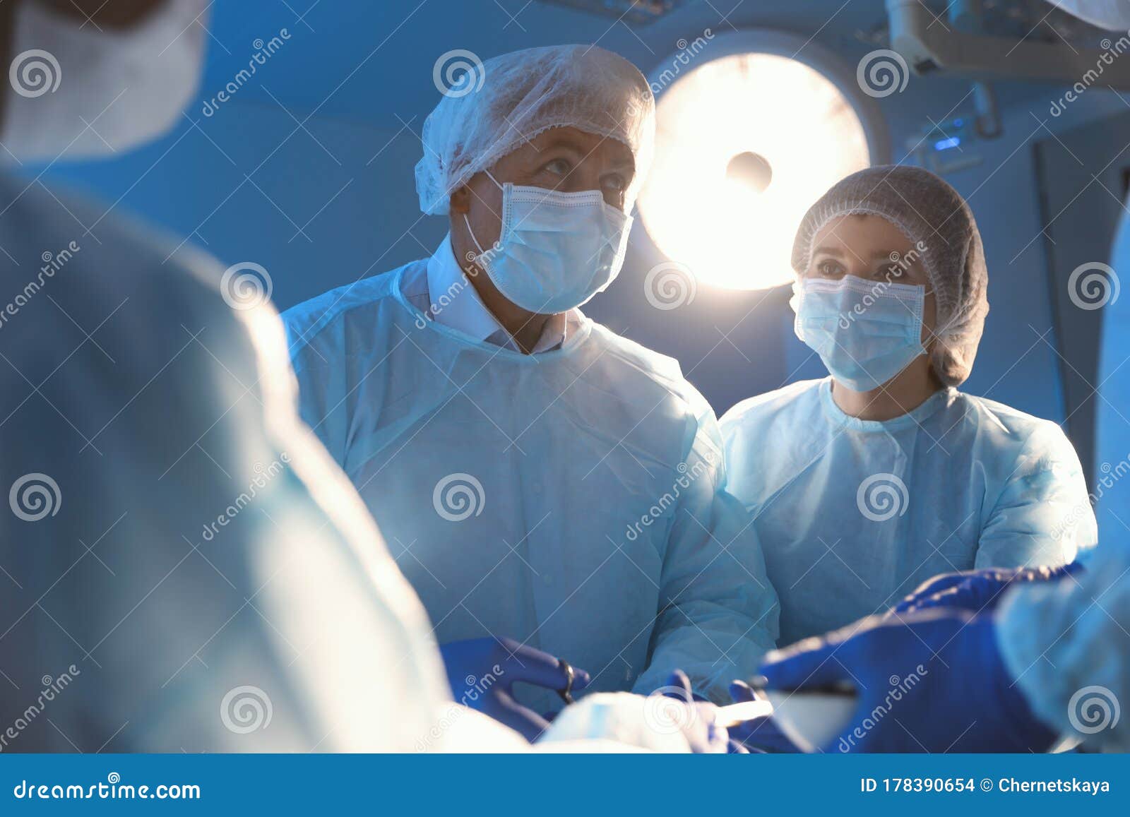 Team of Doctors Performing Operation in Surgery Room Stock Photo ...