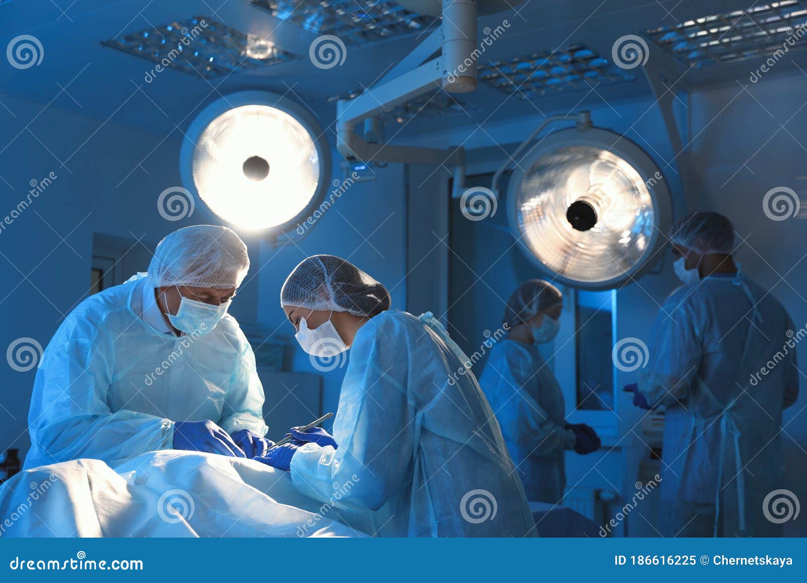 Team of Doctors Performing Operation in Surgery Room Stock Image ...