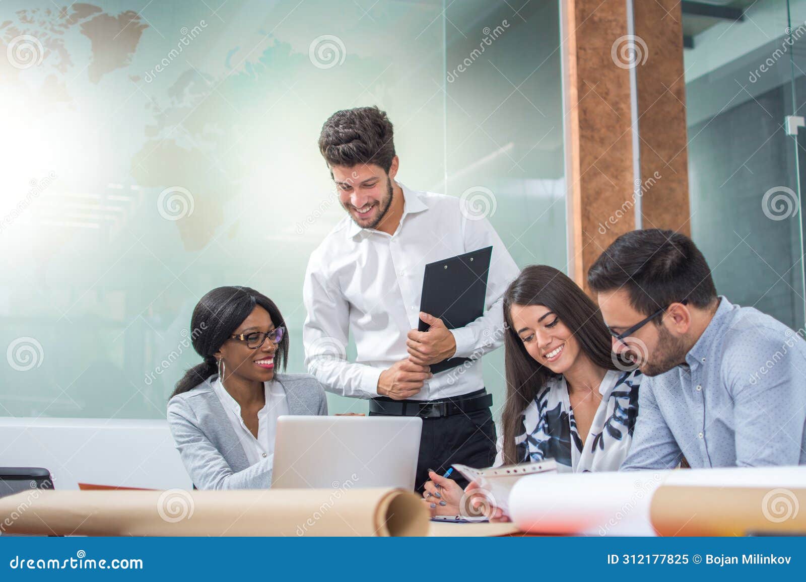 Team of Professional Engineers Working with Blueprints in Office Stock ...