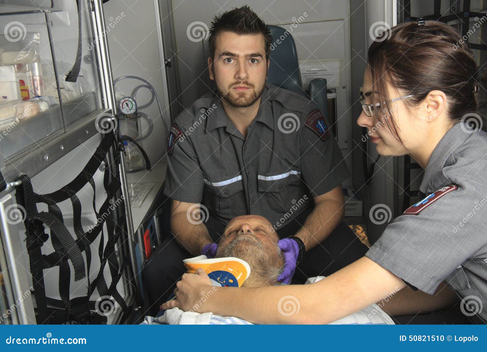 Team of Professional Paramedics Giving Unconscious Stock Photo - Image ...