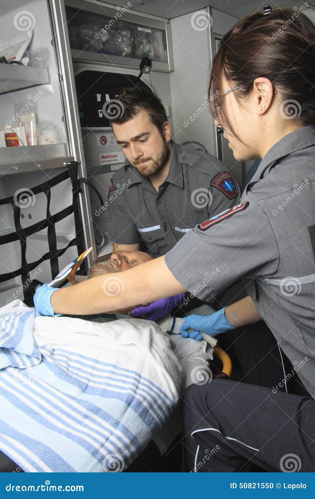 Team of Professional Paramedics Giving Unconscious Stock Photo - Image ...