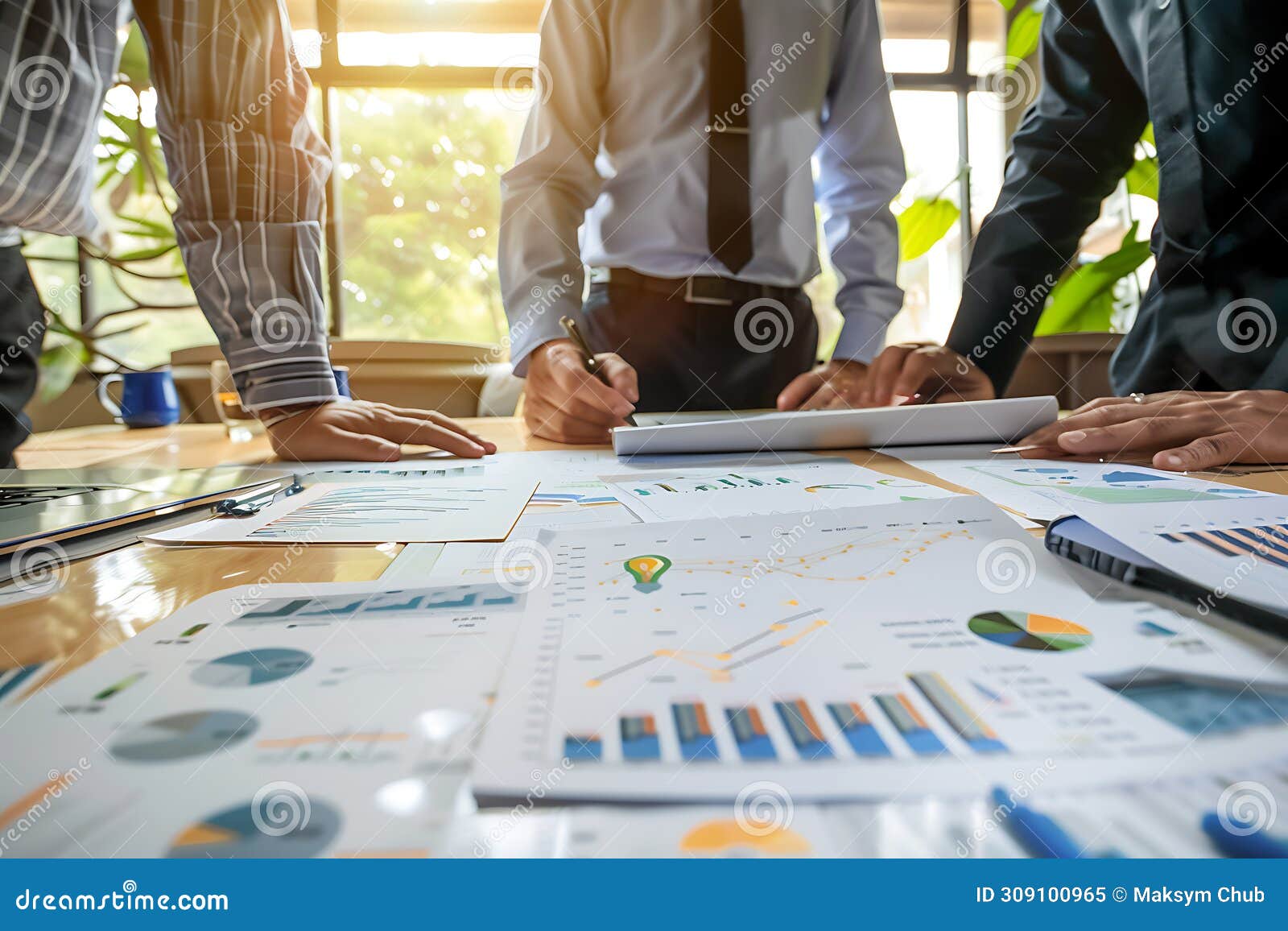 Business Team Analyzing Graphs and Charts during a Meeting Stock Image ...