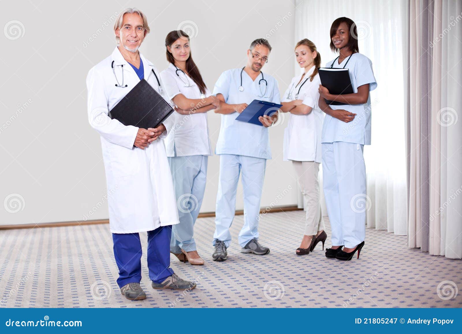Team of Professionals Lead by Mature Doctor Stock Image - Image of lead ...