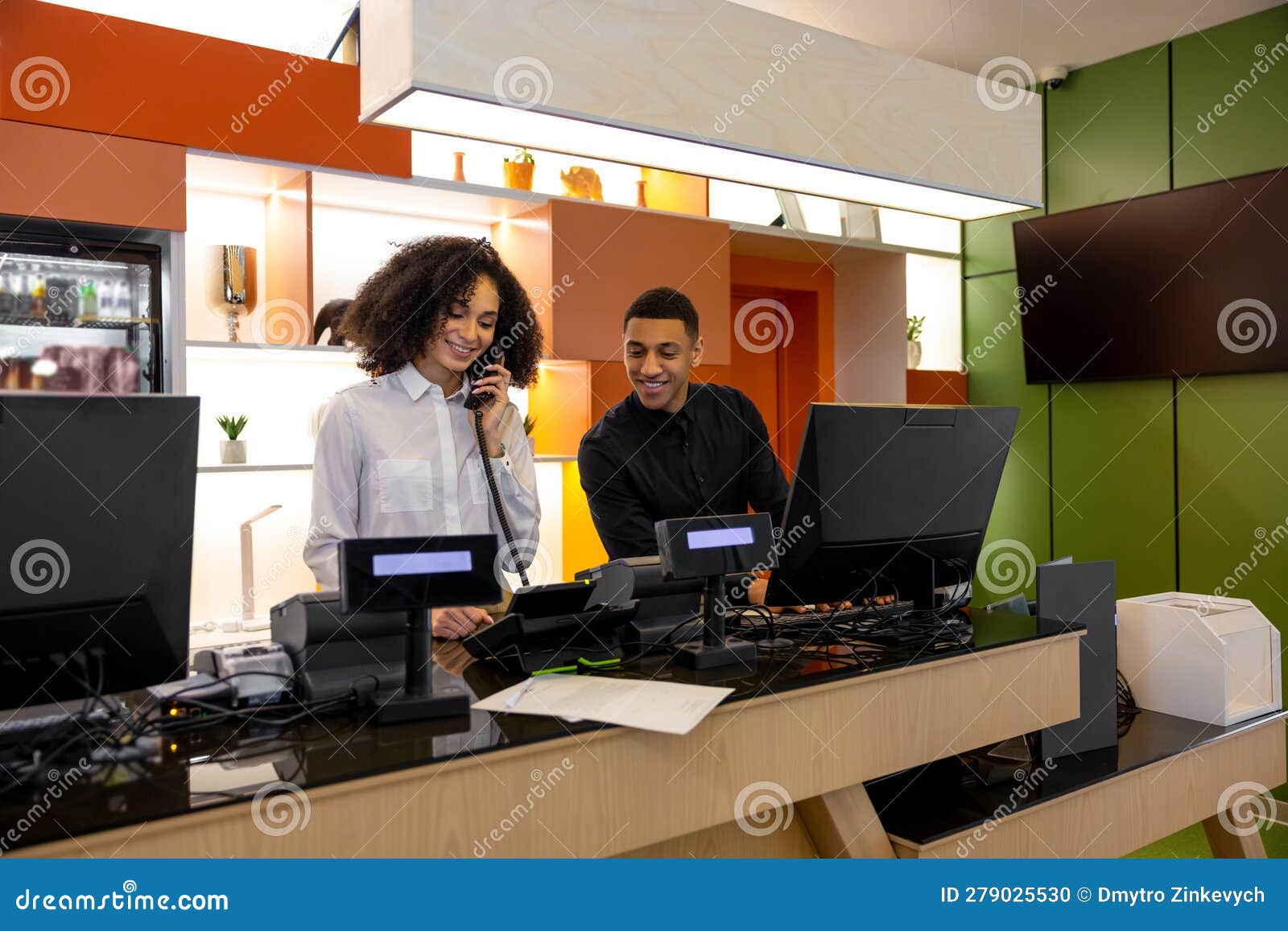 Team of Receptionists Working at the Hotel Reception Desk Stock Photo ...