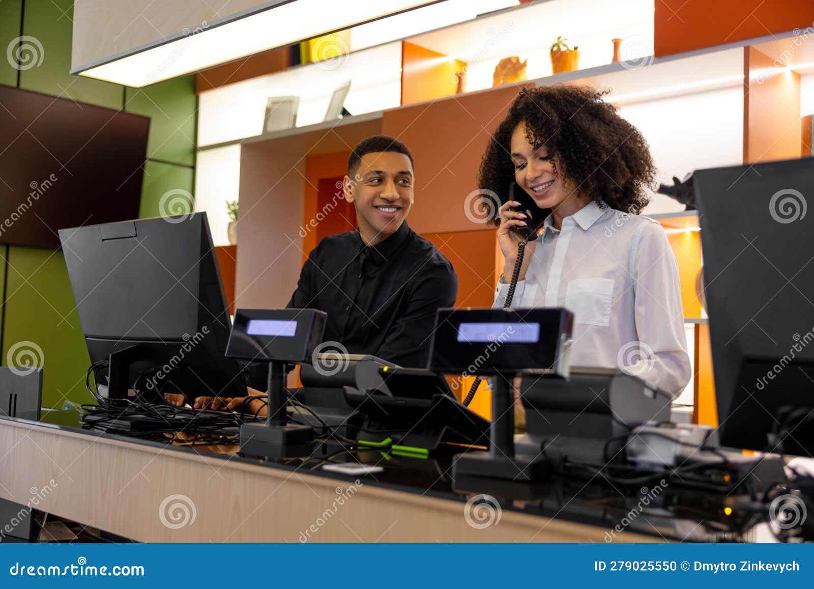 Team of Receptionists Working at the Hotel Reception Desk Stock Photo ...