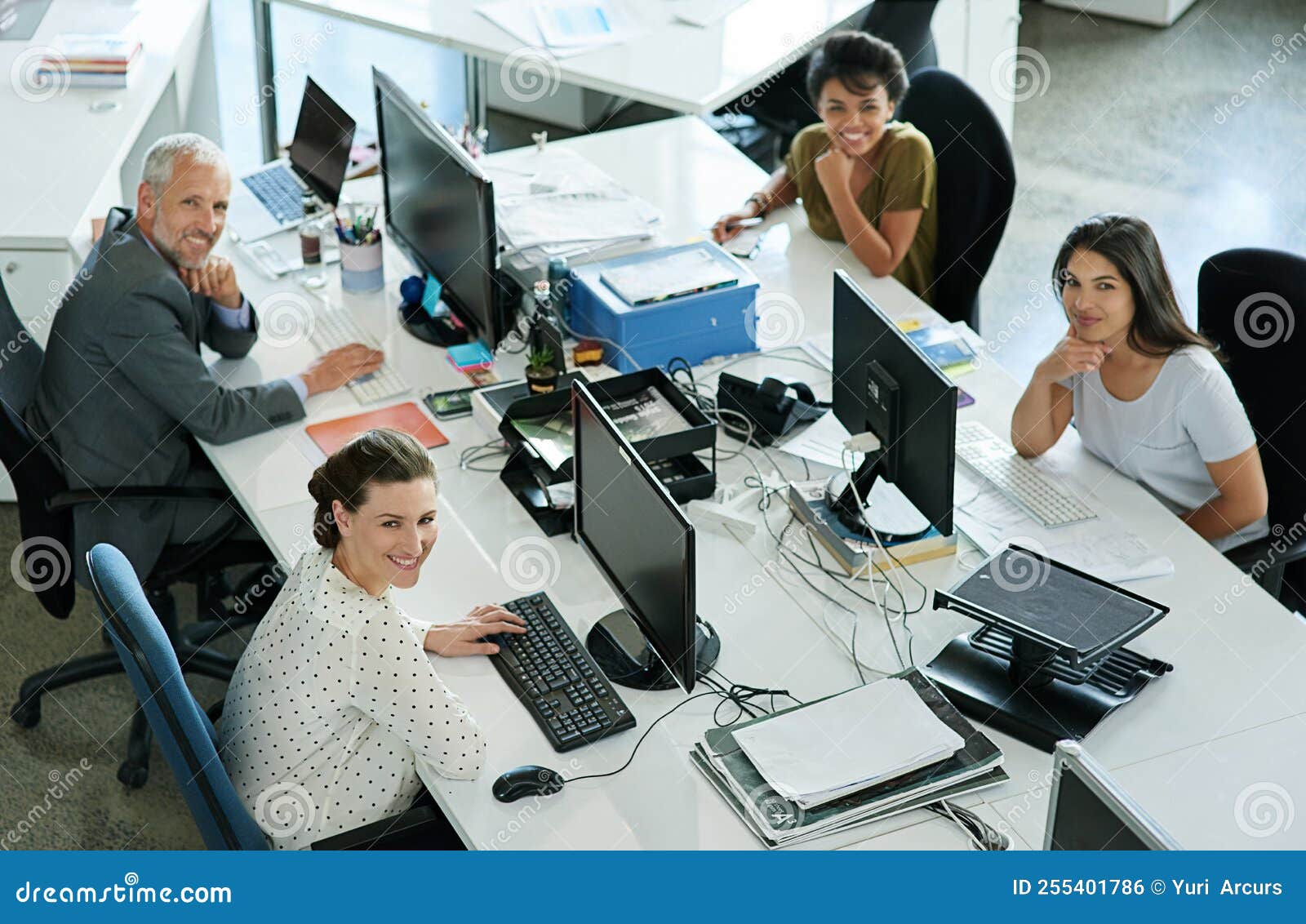 This Team is on the Same Page. Portrait of a Group of Coworkers Sitting ...
