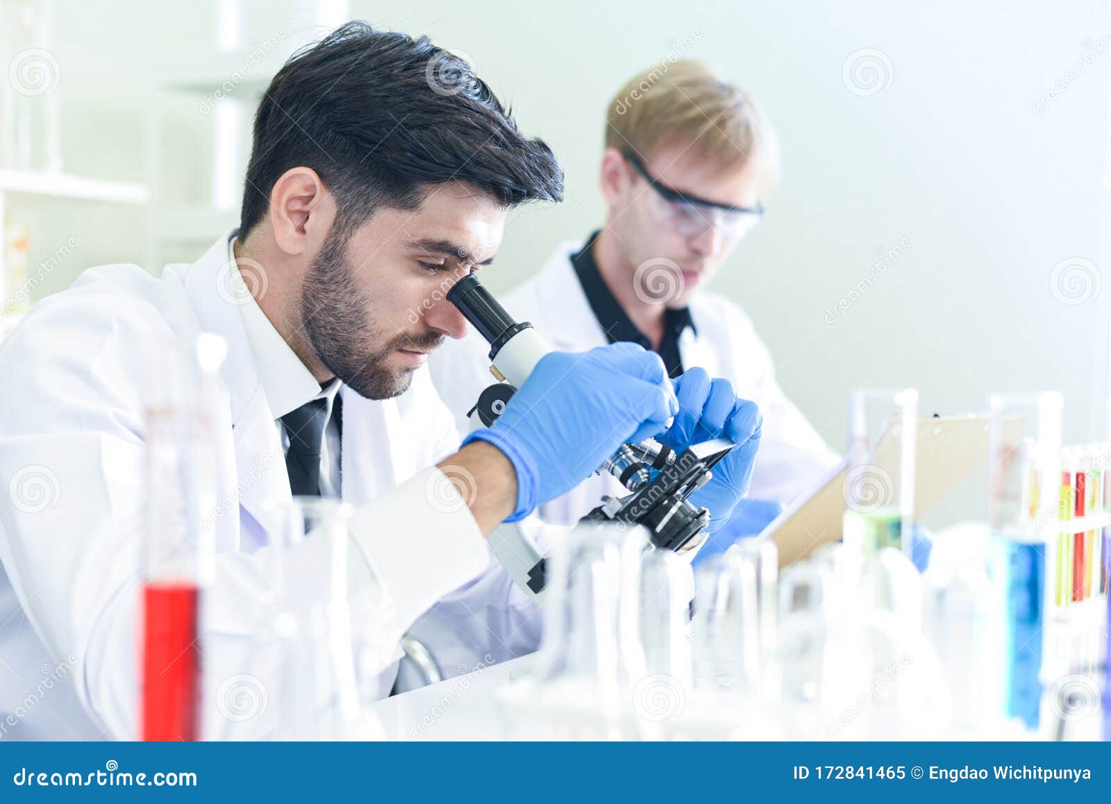 Team of Scientist Research Working Together Conduct Experiments and ... Team of Scientist Research Working Together Conduct Experiments and ...