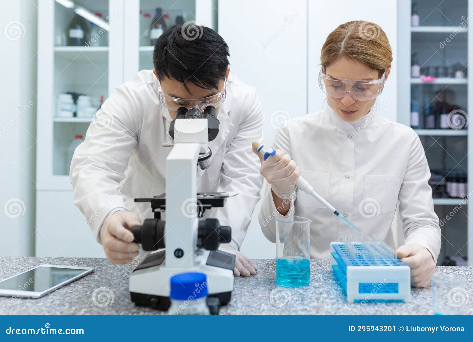 A Team of Scientists and Chemists Work in the Laboratory on the Study ...
